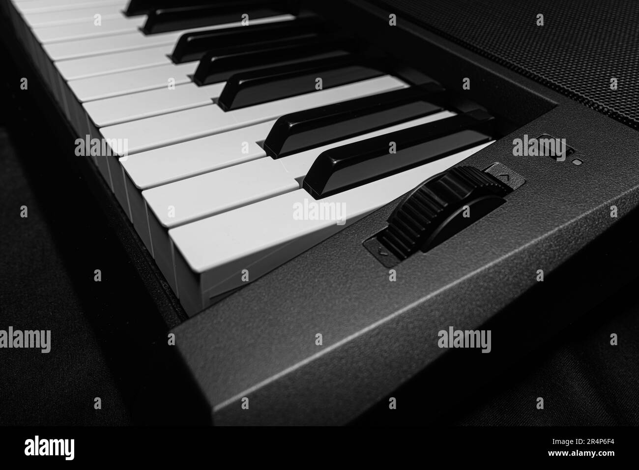 Keyboard synthesizer on a dark background Stock Photo - Alamy