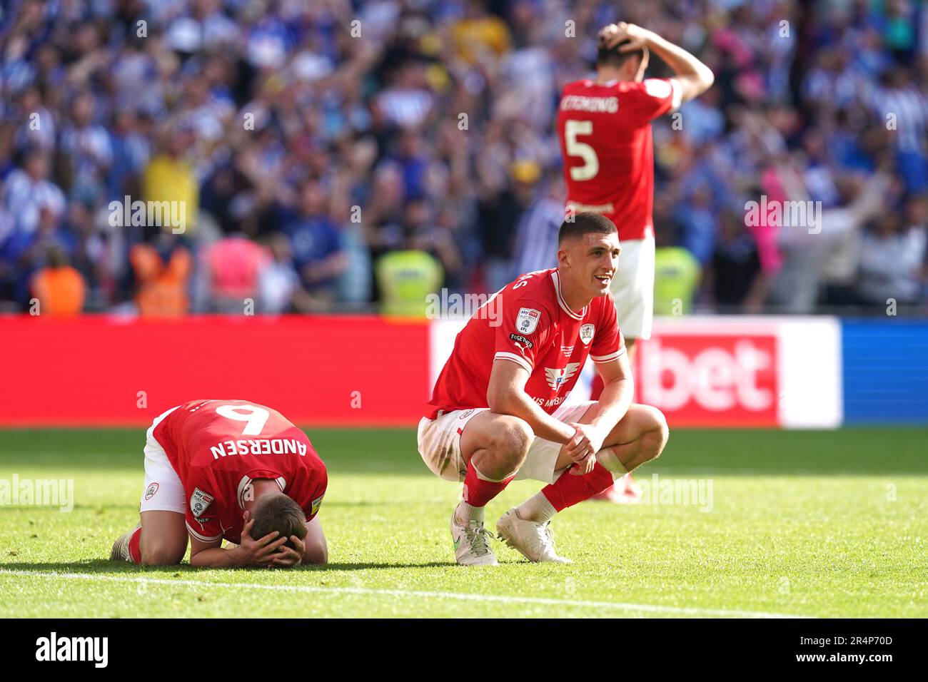 Barnsley's Mads Andersen (left), Bobby Thomas and Liam Kitching look ...