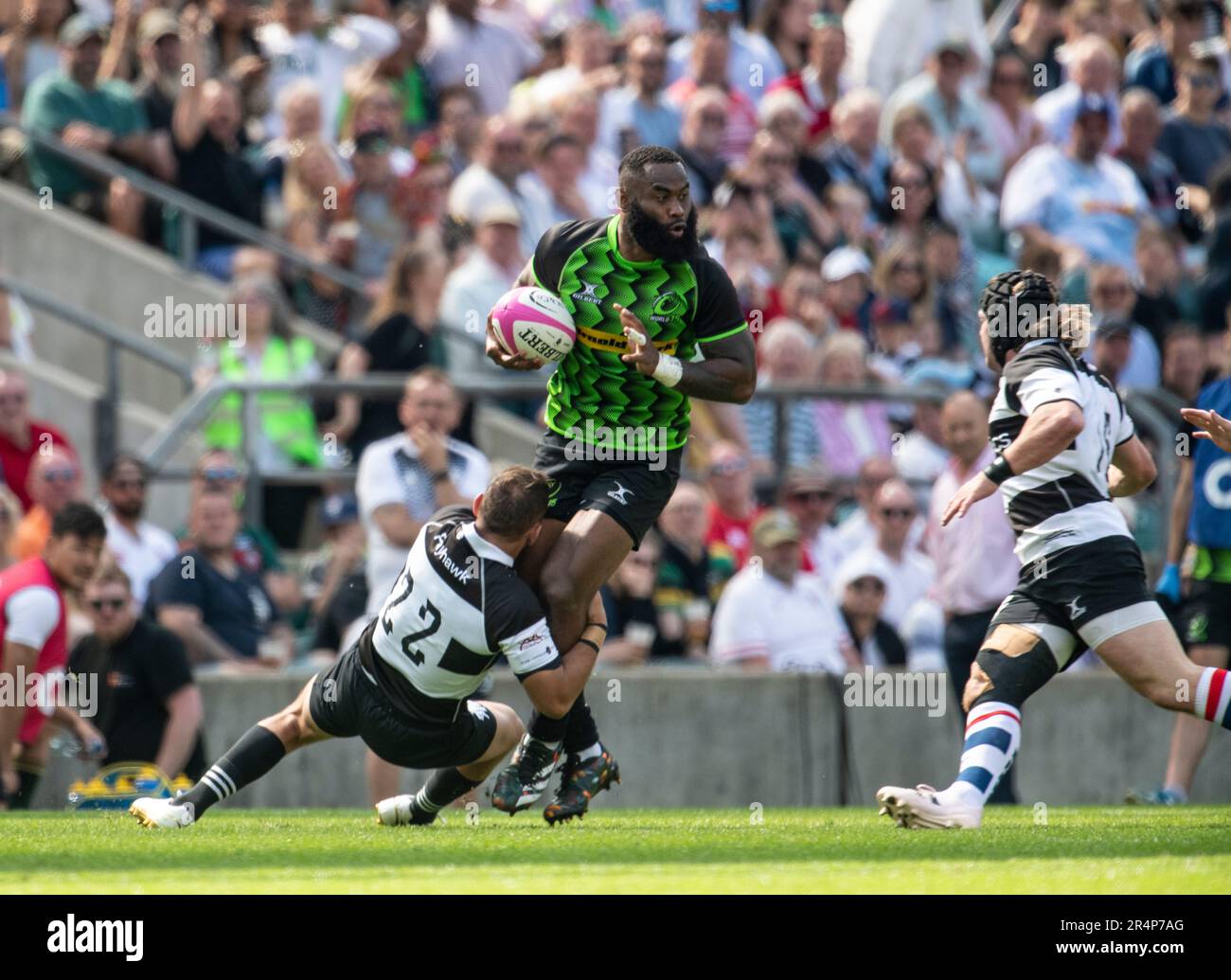 Rhys Patchell of the Barbarians is tackled by Semi Radradra of the ...