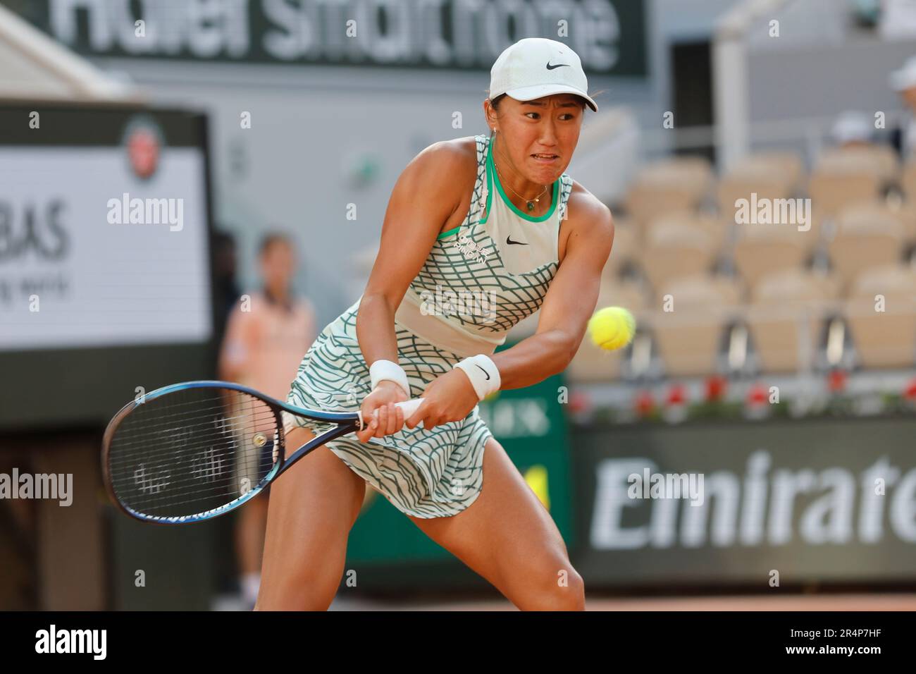 China's Wang Xiyu plays a shot against France's Caroline Garcia during ...