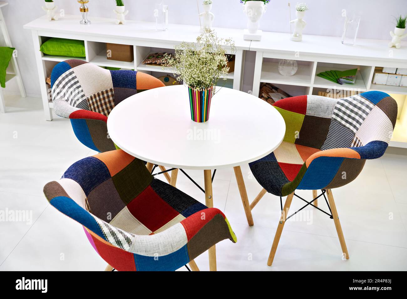Beautiful chairs and a table in the interior Stock Photo - Alamy