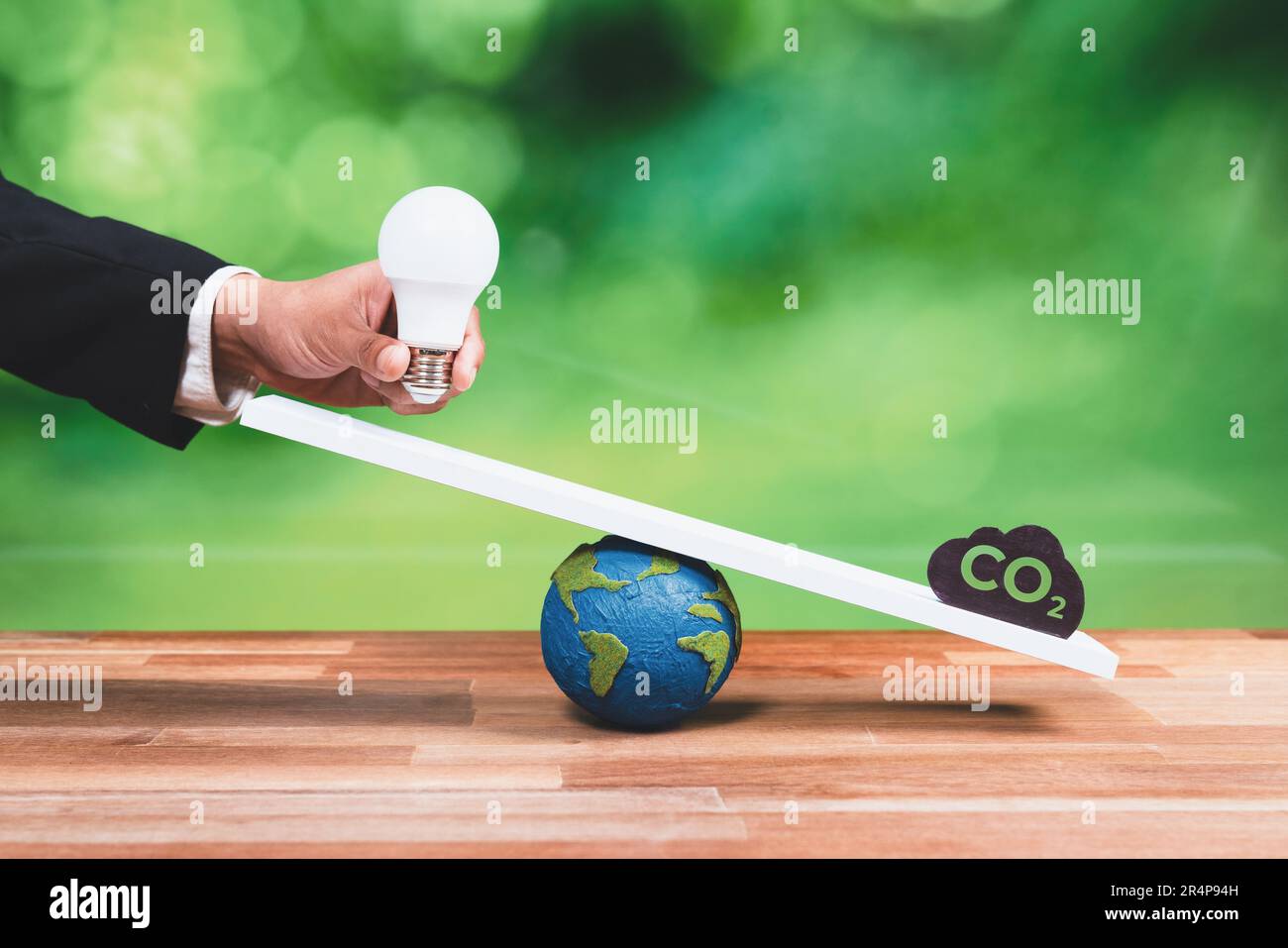 Sustainable idea in balance on weight scale of eco conservation vs CO2 ...