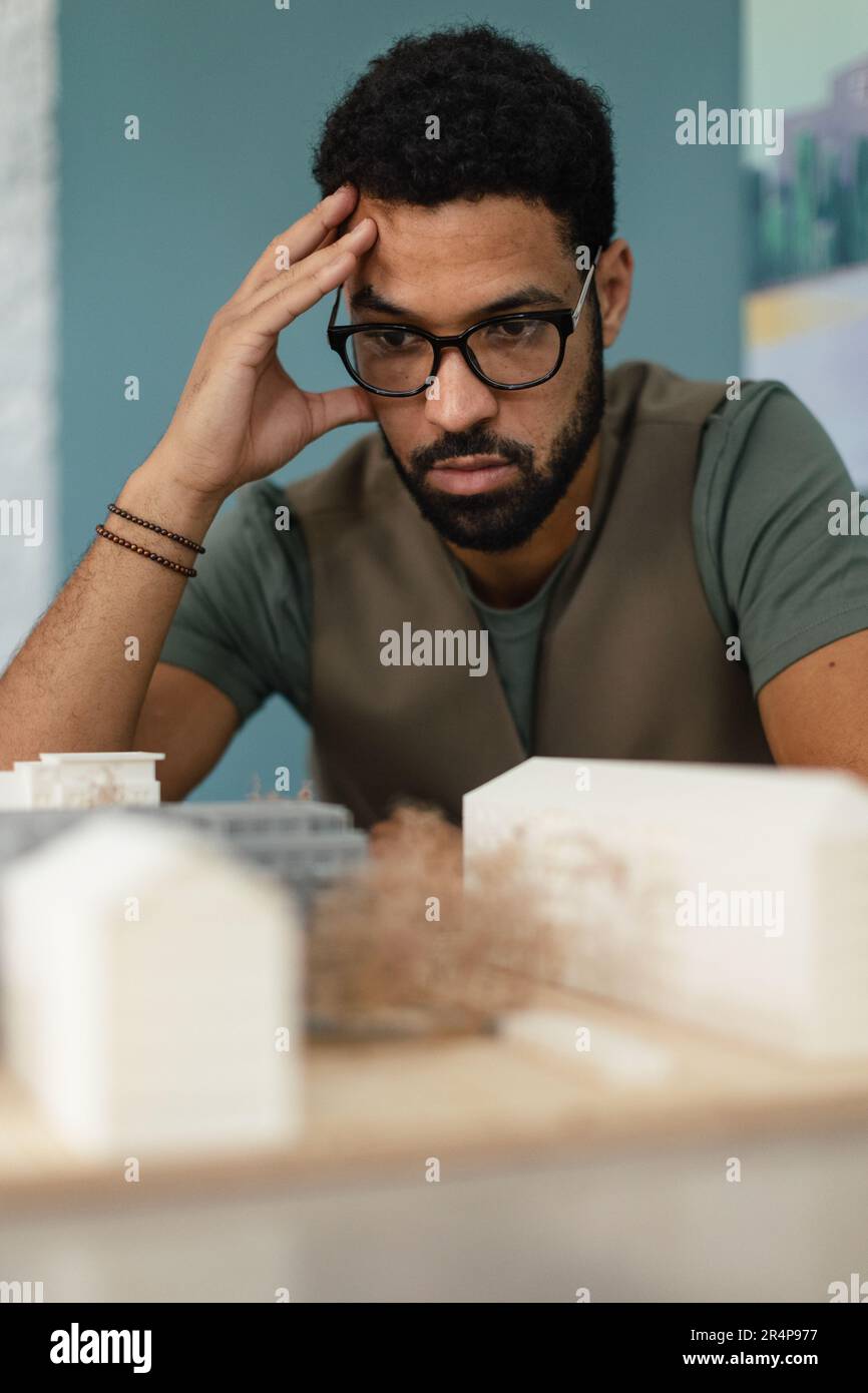 Young architect hard working on design of new house, building Stock ...