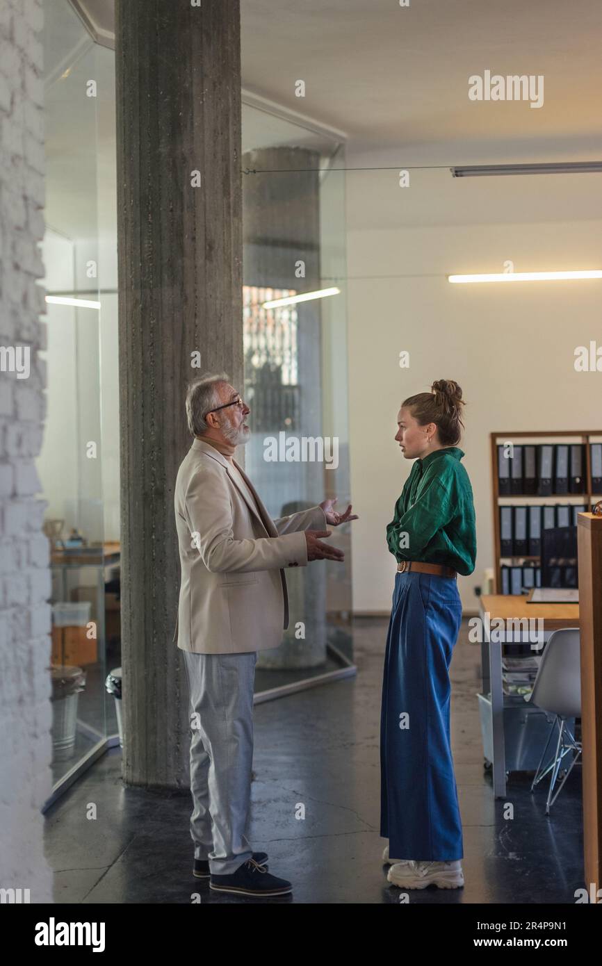 Disappointed boss ceo scolding young office worker, intern Stock Photo ...