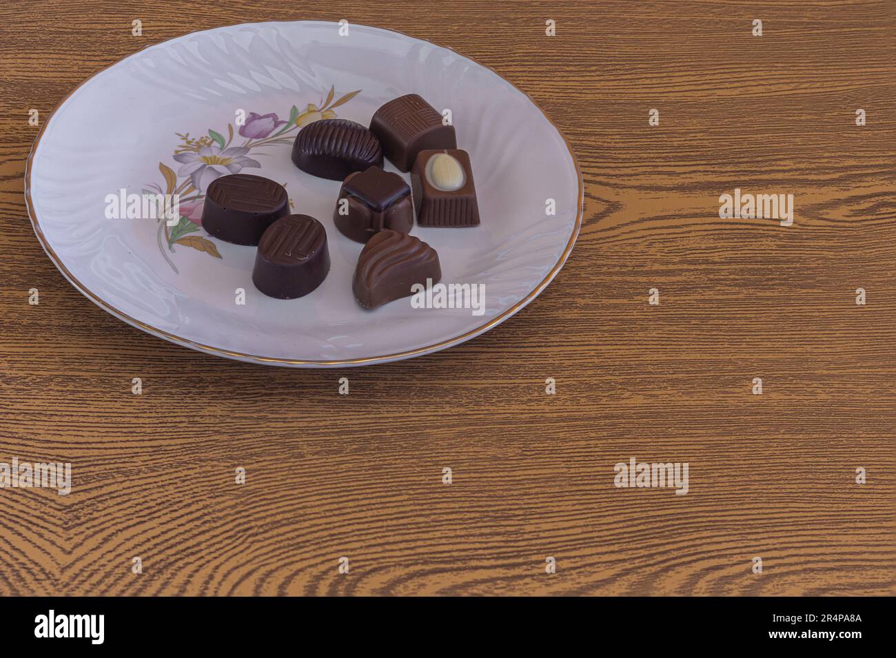 filled chocolate candies various assorted flavors on white plate Stock ...