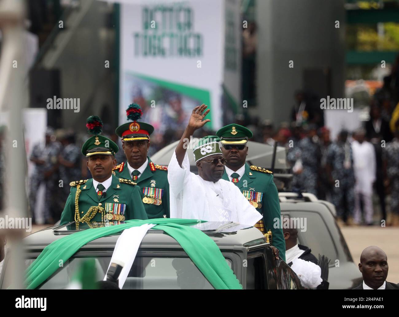 Abuja, Nigeria. 29th May, 2023. Bola Ahmed Tinubu (Front) waves to people after being sworn in ...