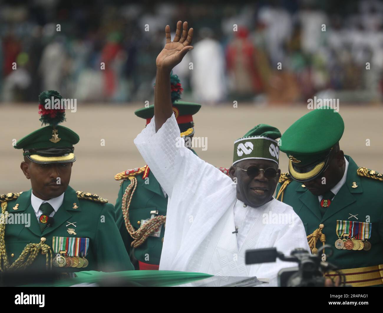 Abuja, Nigeria. 29th May, 2023. Bola Ahmed Tinubu (Front) waves to people after being sworn in ...