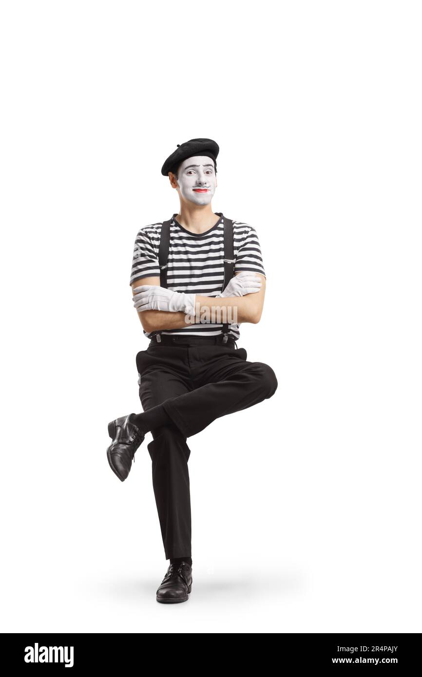 Full length portrait of a mime sitting on an invisible chair isolated ...