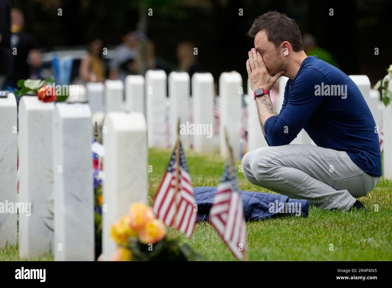 Vadim Gunyan, of Washington, visits the grave of U.S. Army Sgt. John D ...
