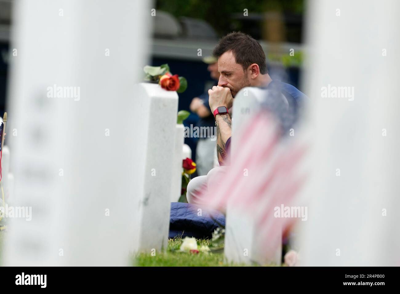 Vadim Gunyan, of Washington, visits the grave of U.S. Army Sgt. John D ...