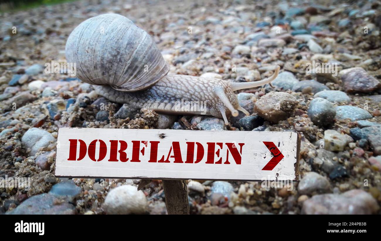 The picture shows a signpost and a sign in German that points in the ...