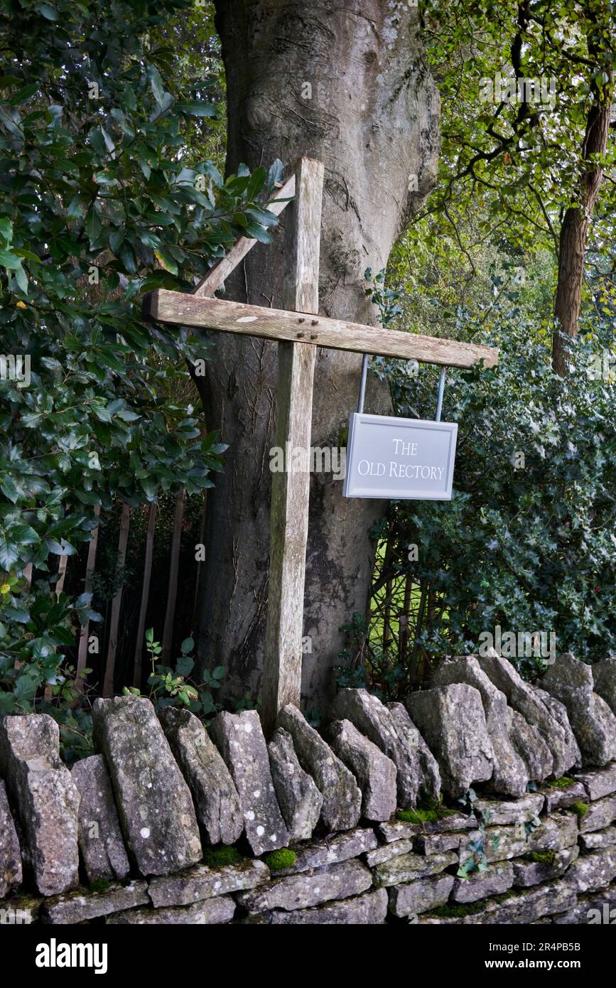 A house sign, "The Old Rectory", with a dry stone wall, England Stock ...