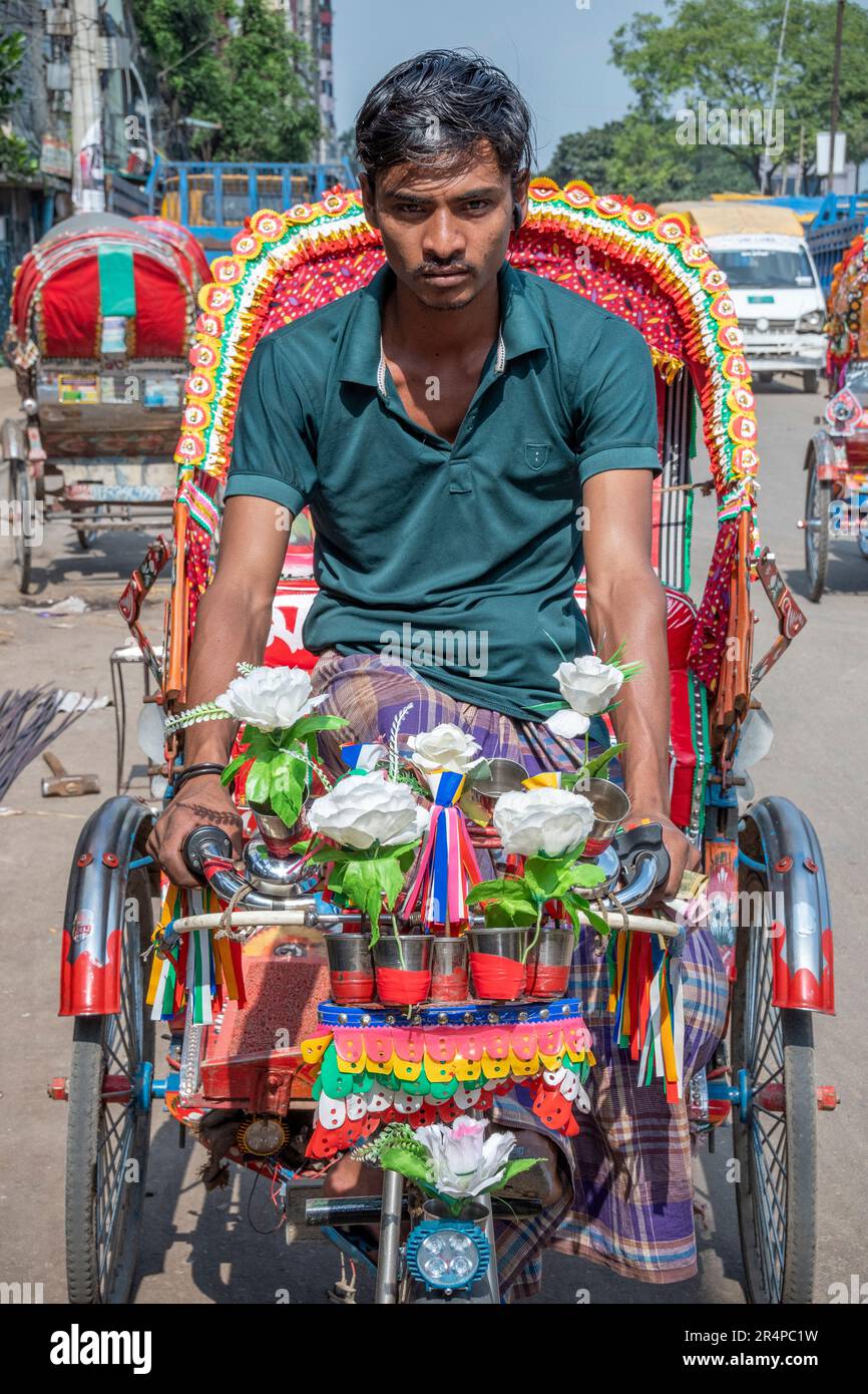 A decorated cycle rickshaw and its driver in Dhaka, Bangladesh Stock ...
