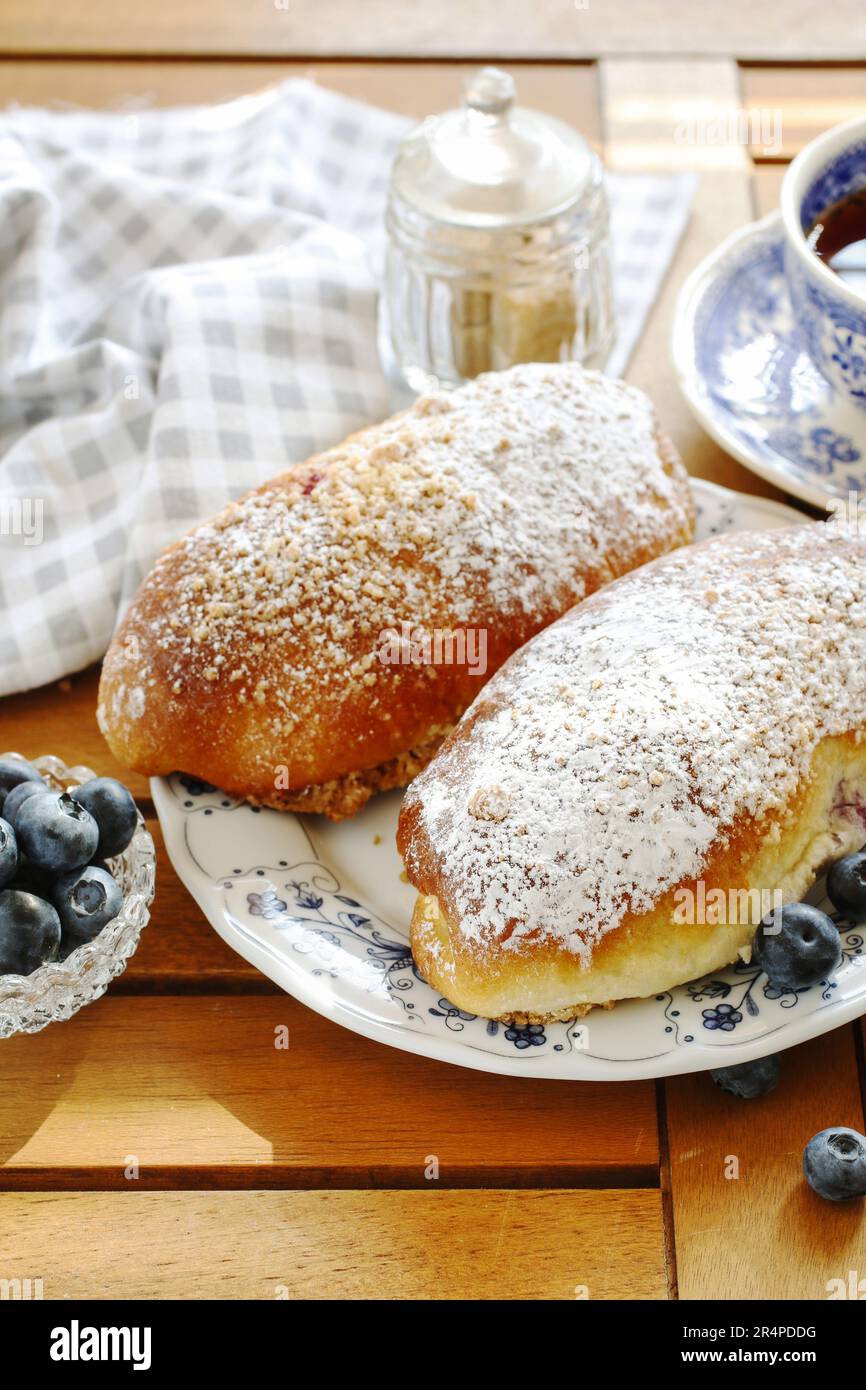 Traditional buns with blueberry filling. Party dessert Stock Photo - Alamy