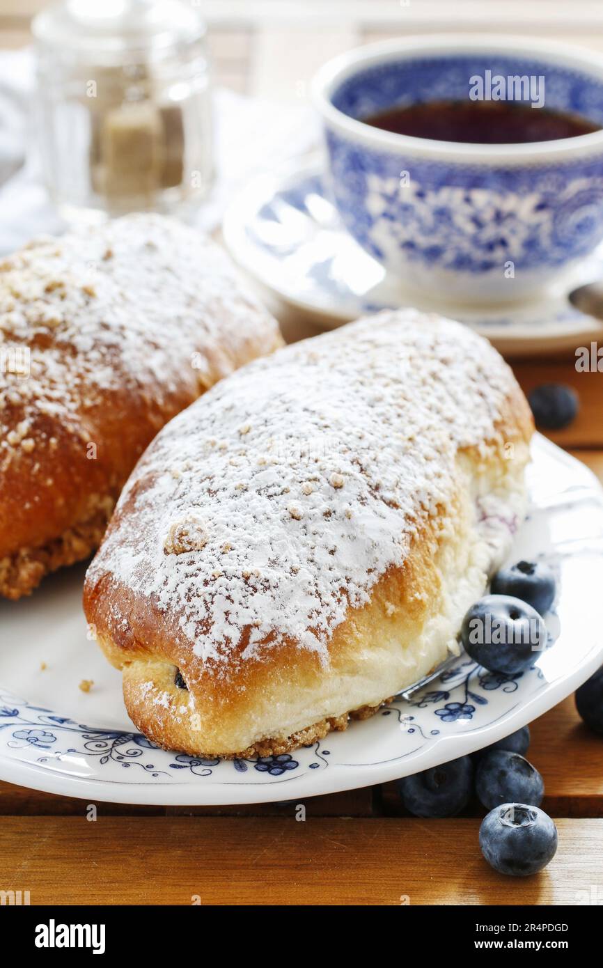 Traditional buns with blueberry filling. Party dessert Stock Photo - Alamy