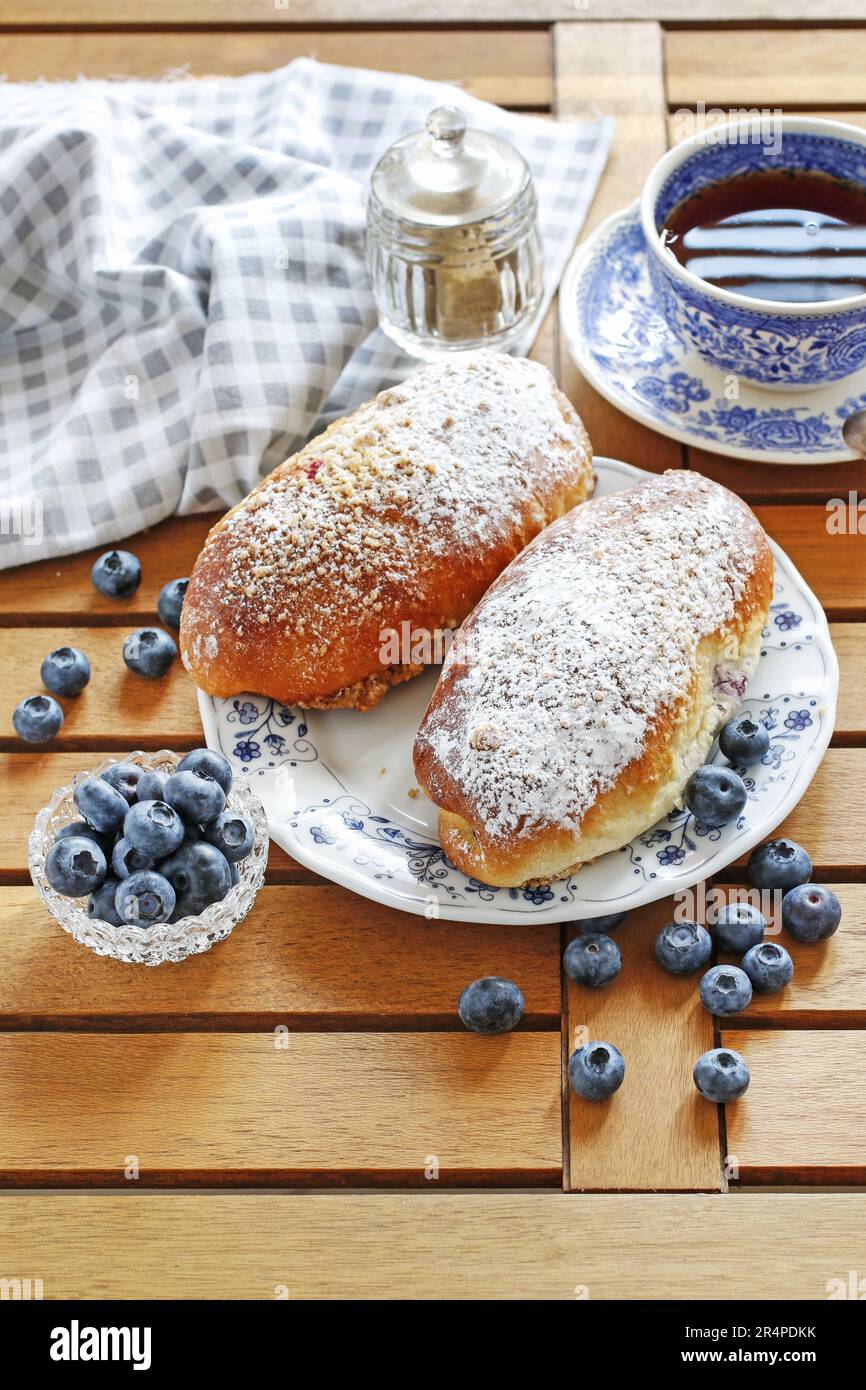 Traditional buns with blueberry filling. Party dessert Stock Photo - Alamy