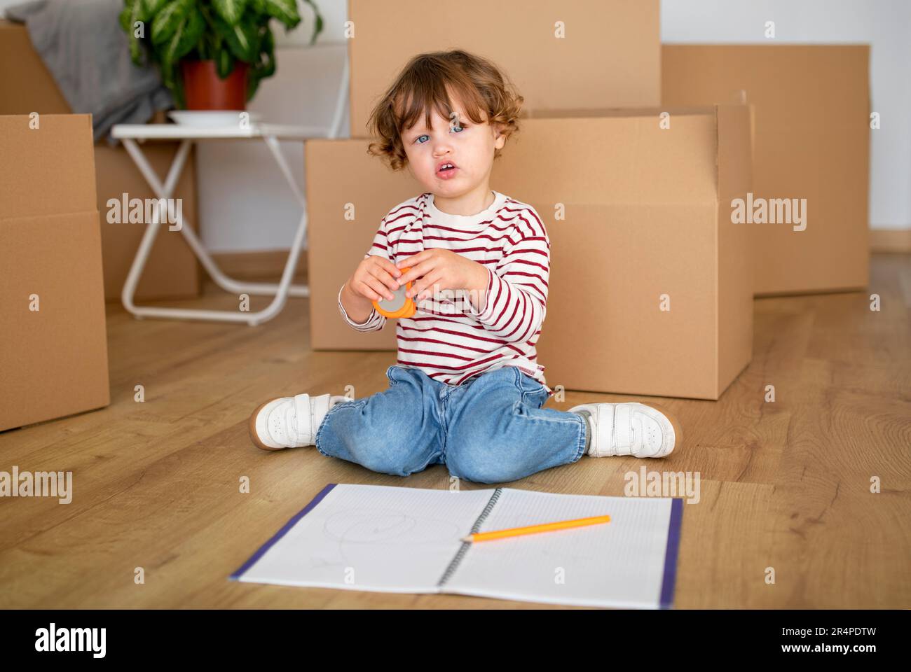 Portrait Of Cute Little Boy Playing With Tape Ruler At Home Stock Photo ...