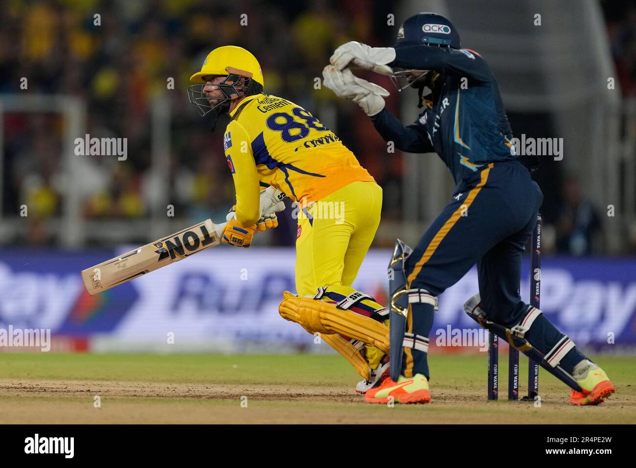Chennai Super Kings' Devon Conway, left, runs after playing a shot during the Indian Premier ...