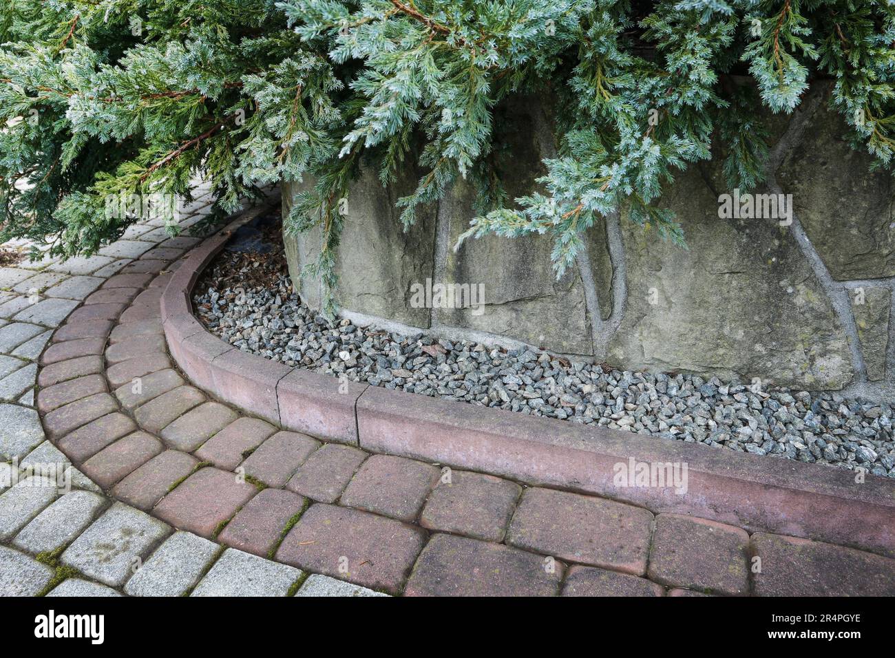 Decorative small pebbles and a paving stones in the garden. Garden ...