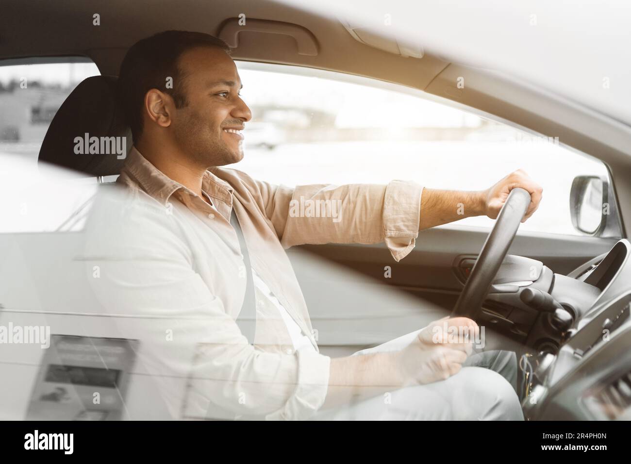 Cheerful Middle Eastern Man Driving Car Sitting In Driver's Seat Stock ...