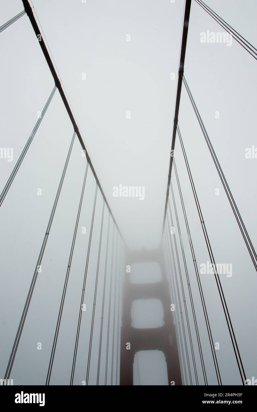 View through fog looking up on the Golden Gate Bridge, San Francisco ...