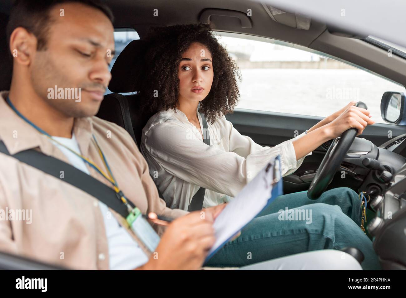 Driver Woman Failing Driving Test Looking At Instructor In Car Stock ...