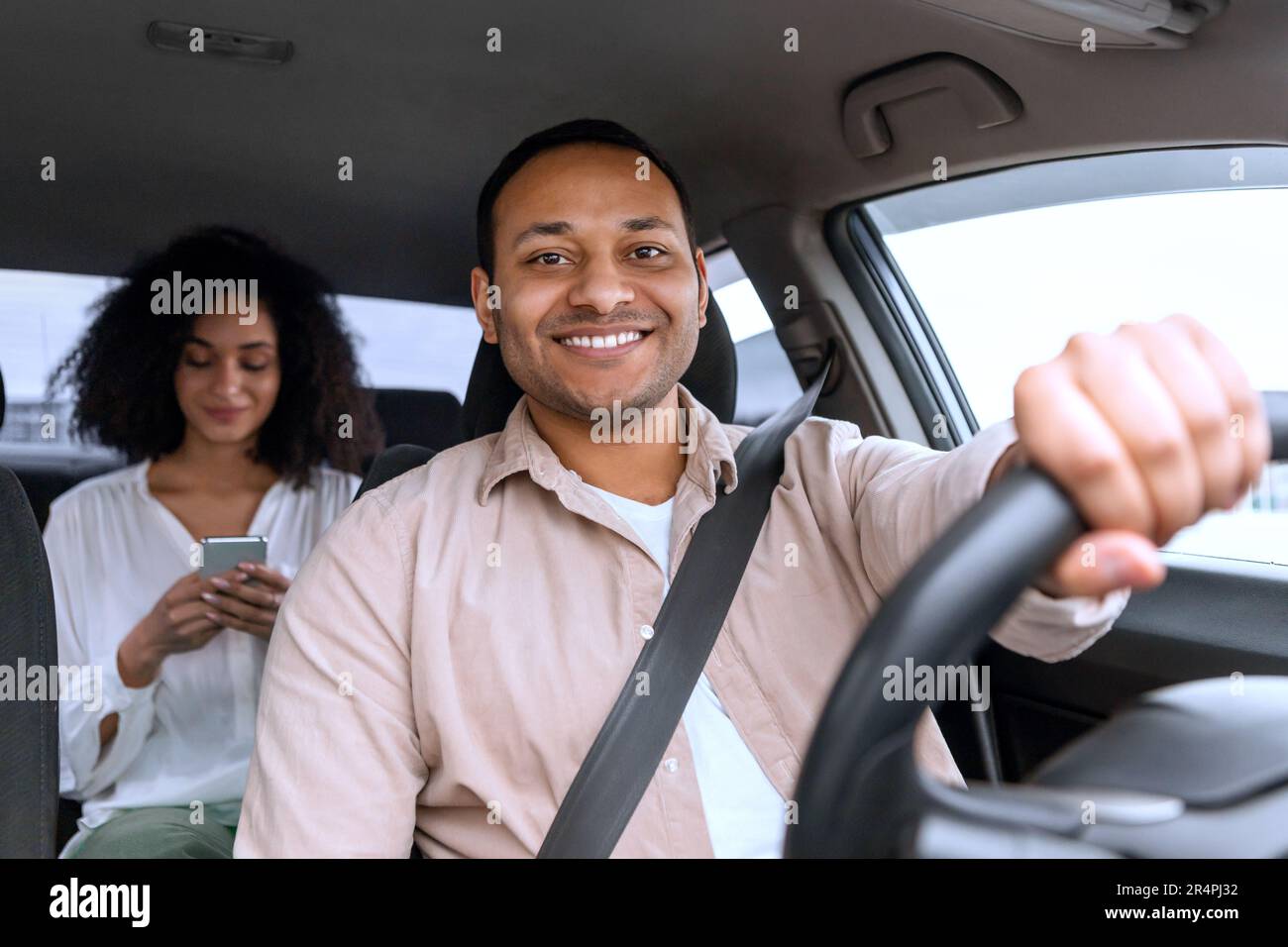 Cheerful Driver Guy Posing At Wheel Driving Auto With Passenger Stock ...