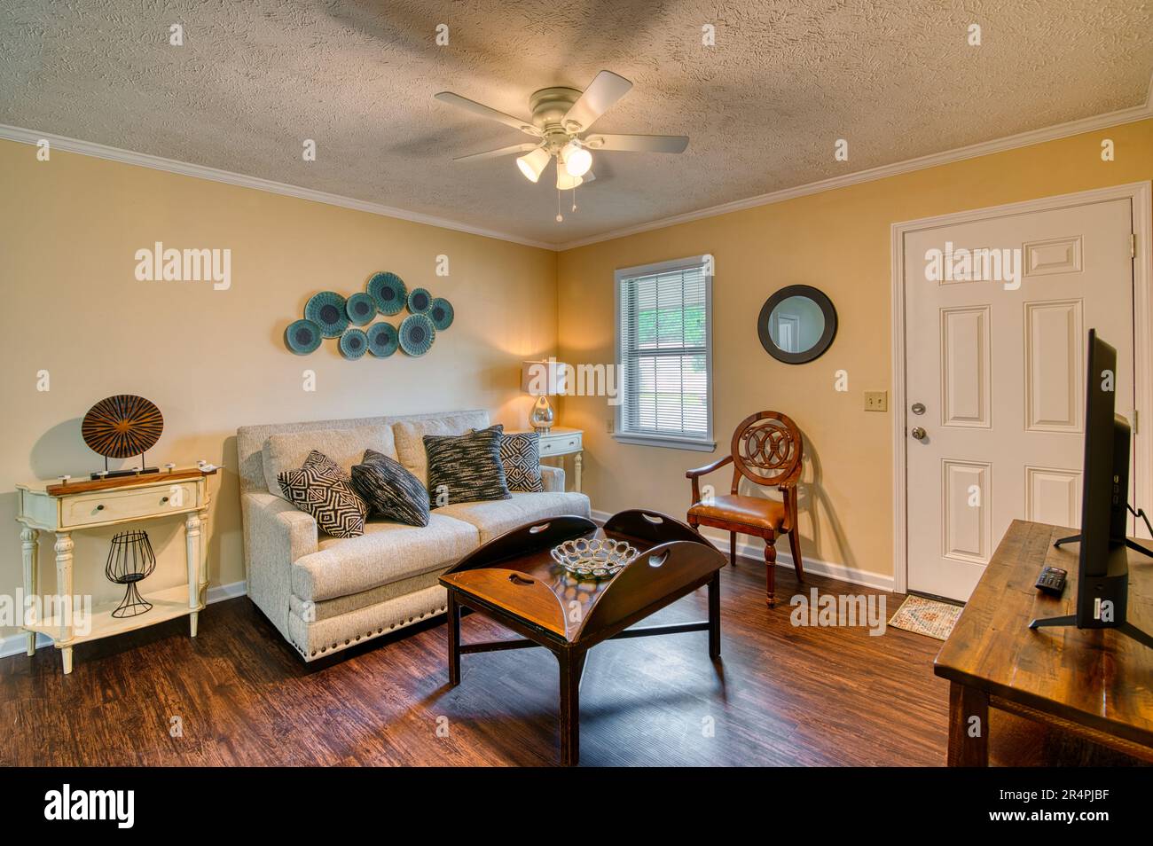 A comfortable living room with modern feel and a touch of color Stock ...