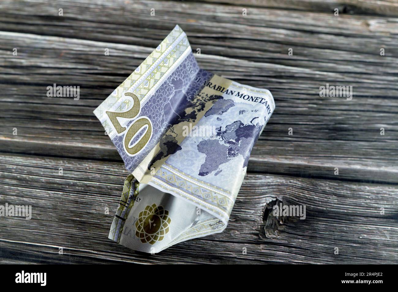 Crumpled Saudi Arabia money of 20 SAR twenty riyals with G20 summit ...