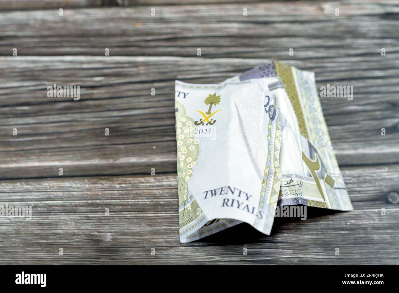 Crumpled Saudi Arabia money of 20 SAR twenty riyals with G20 summit ...