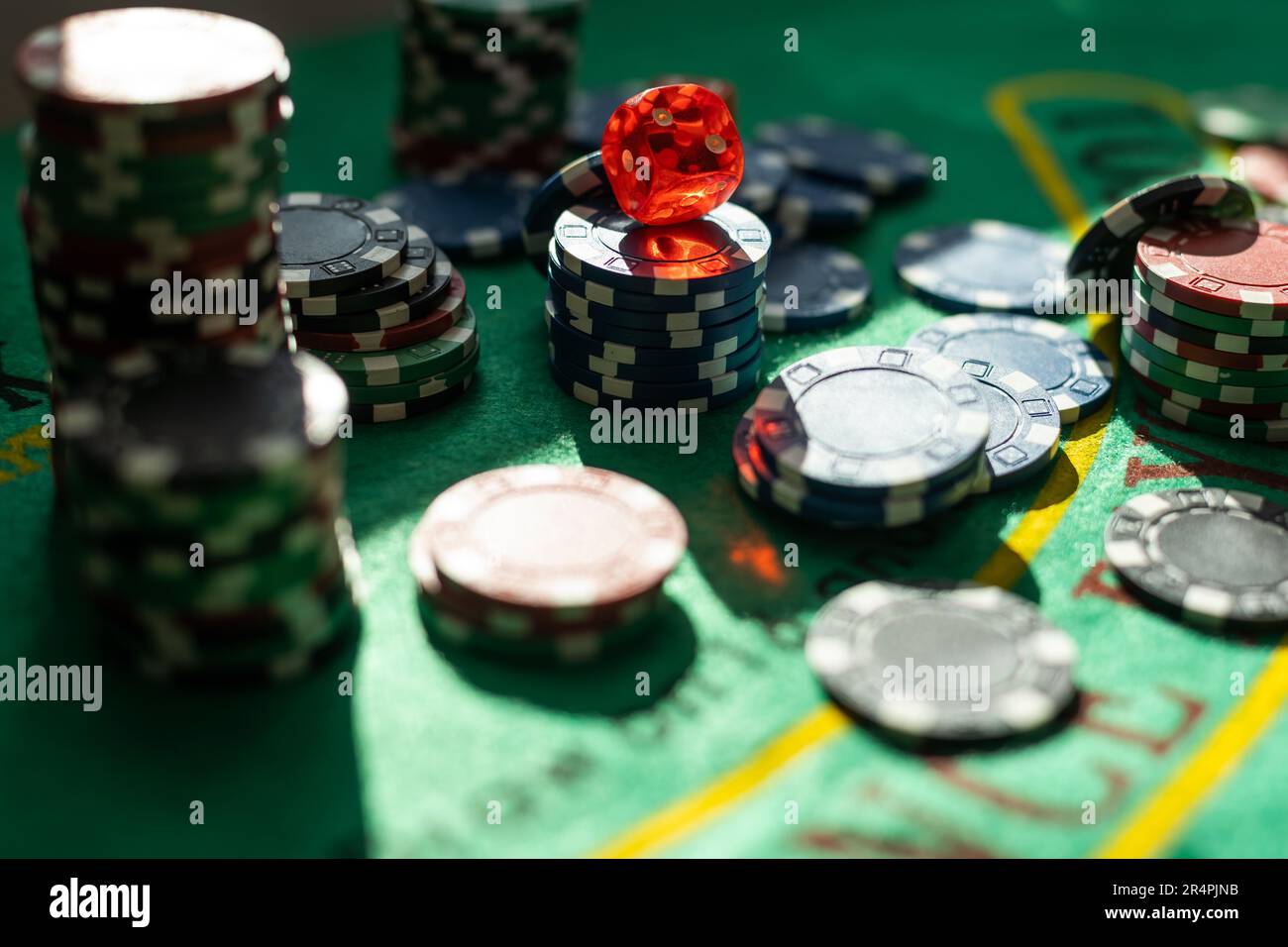 Poker Chips on a gaming table with dramatic lighting Stock Photo - Alamy