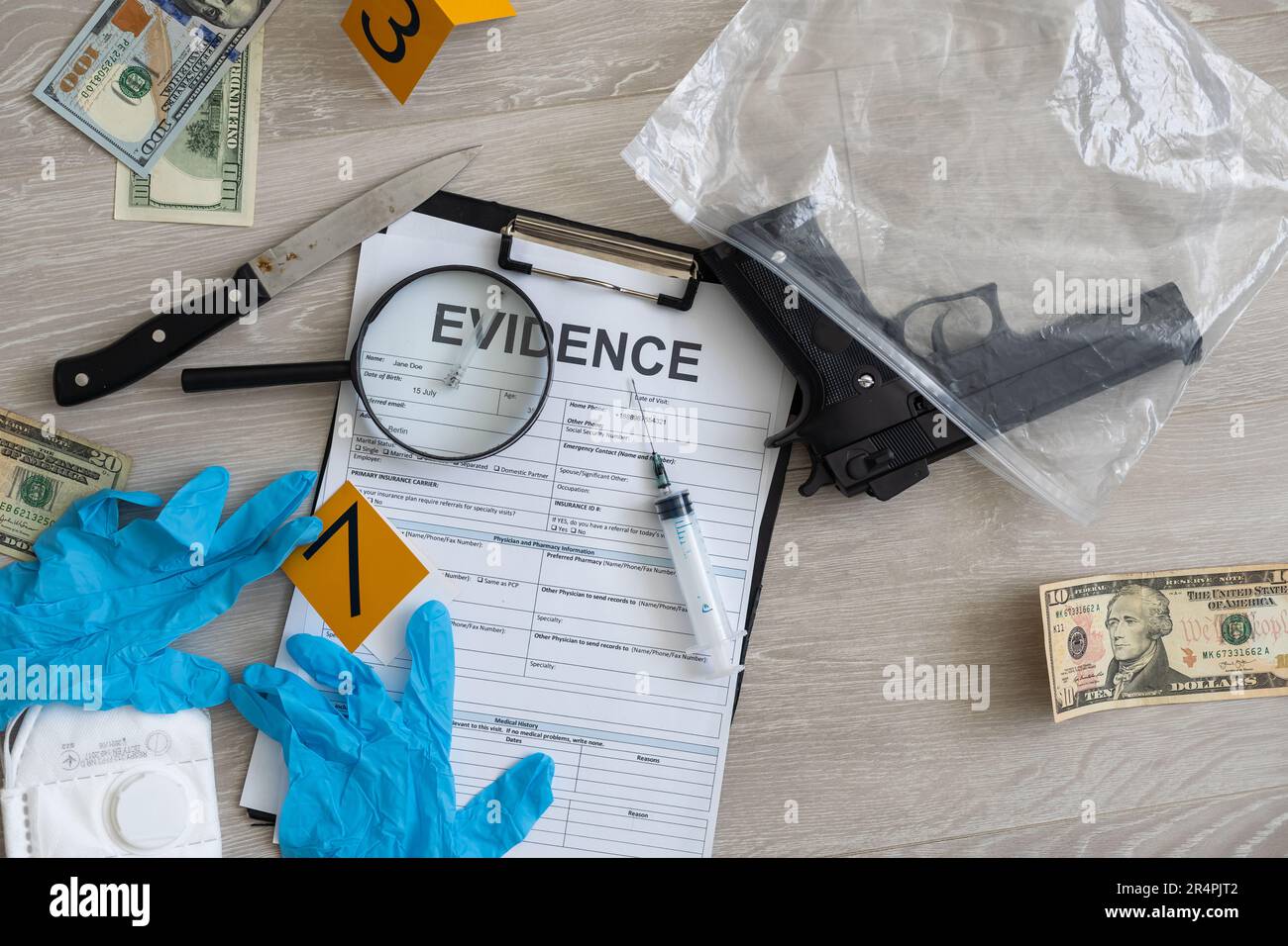 Crime scene concept with a gun and evidence markers high contrast image ...