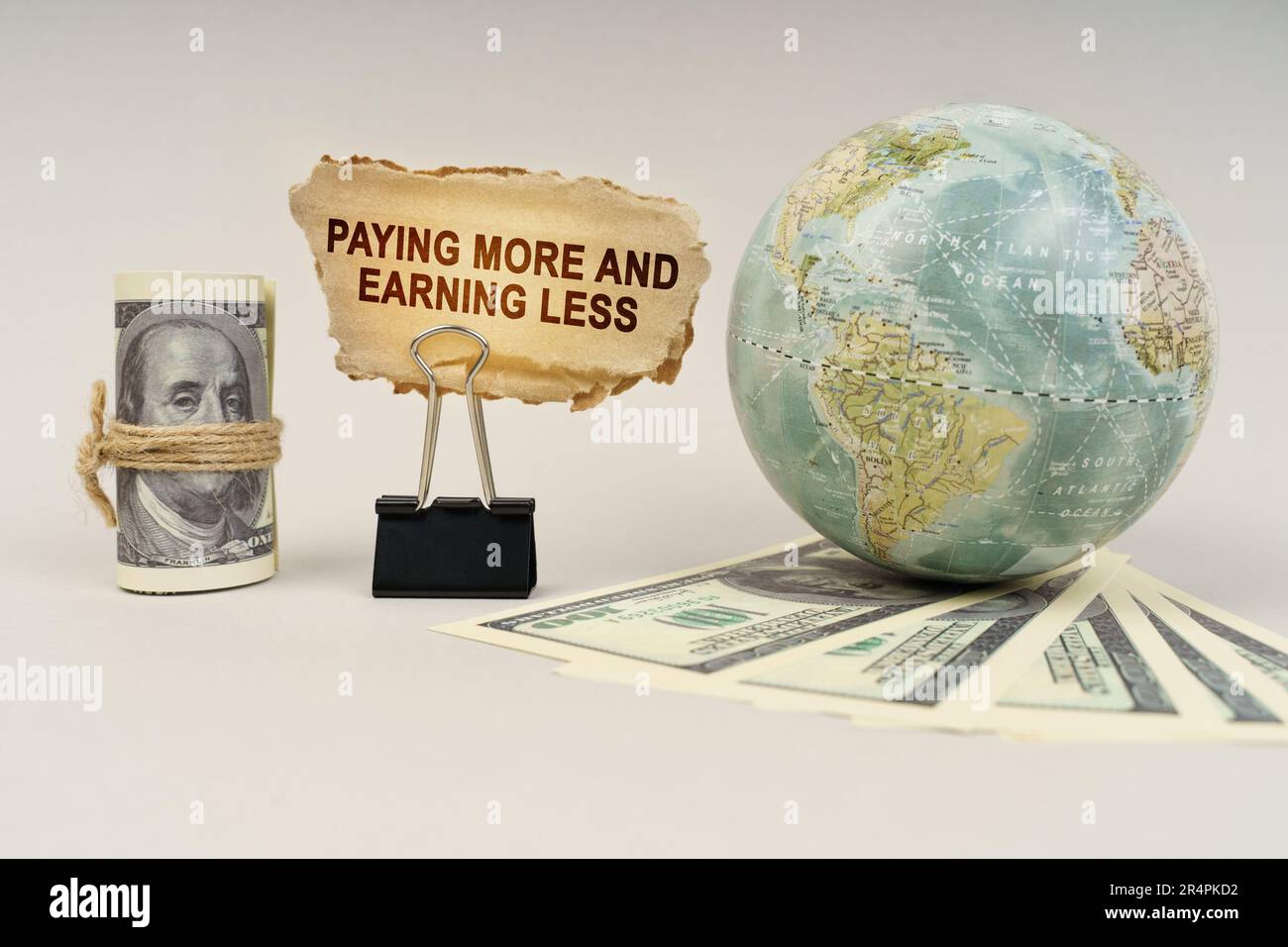 Business and finance concept. On the table are dollars, a globe and ...