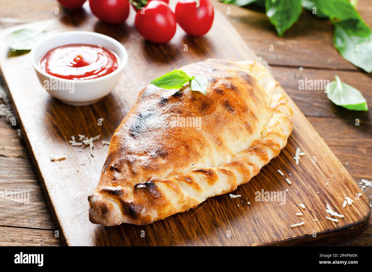 Delicious Pizza Calzone, Traditional Italian Pizza with Tomatoes and ...