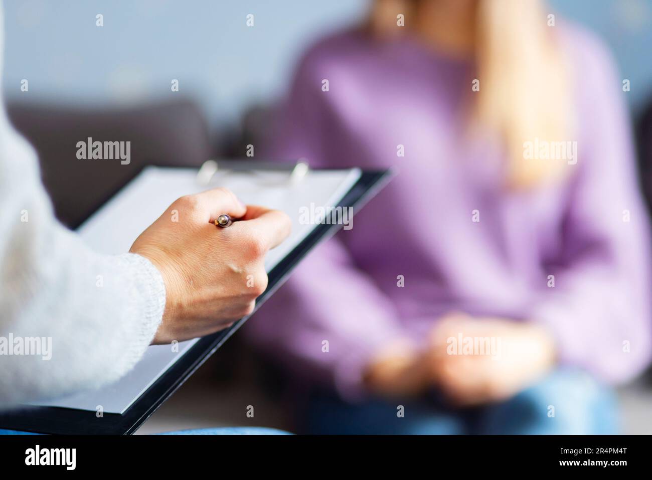 Psychotherapy session, a woman is talking with her psychologist at cozy ...