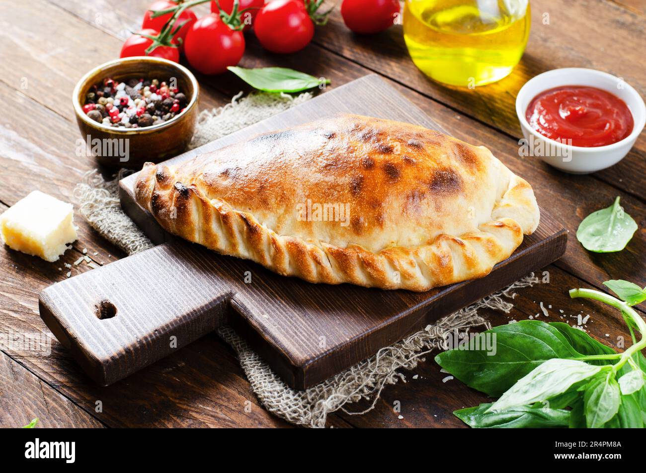 Delicious Pizza Calzone, Traditional Italian Pizza with Tomatoes and ...