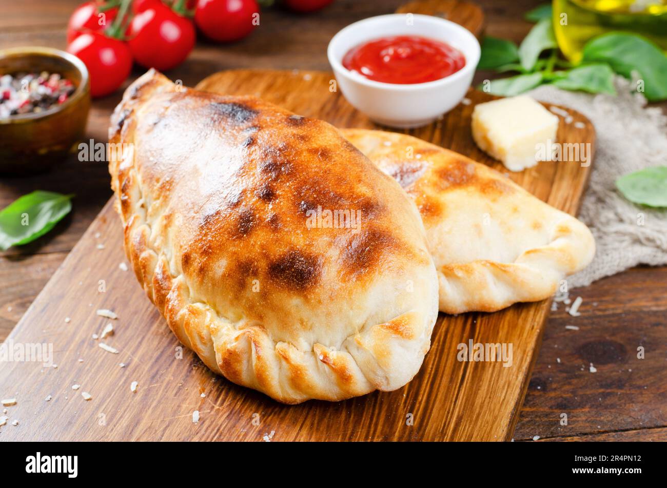 Delicious Pizza Calzone, Traditional Italian Pizza with Tomatoes and ...