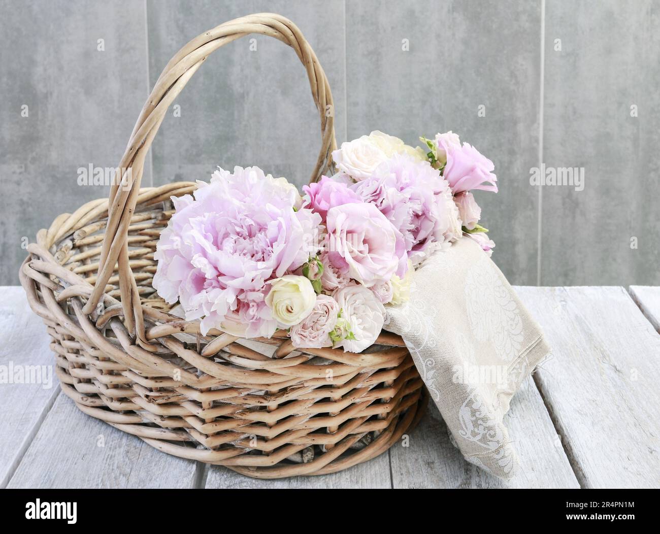 Florist at work: woman shows who to arrange flowers inside a paper ...