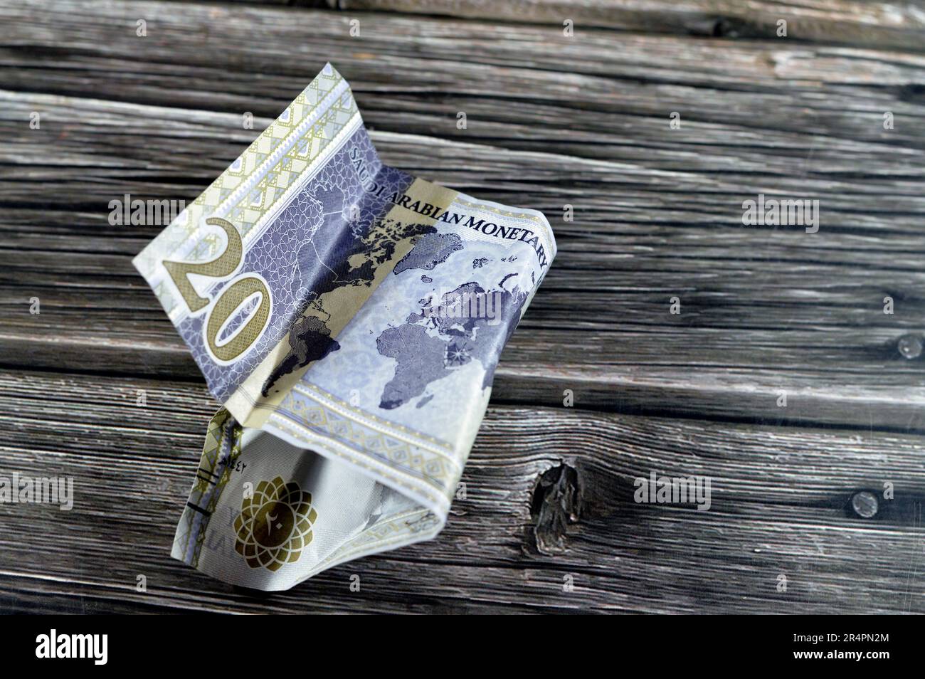 Crumpled Saudi Arabia money of 20 SAR twenty riyals with G20 summit ...