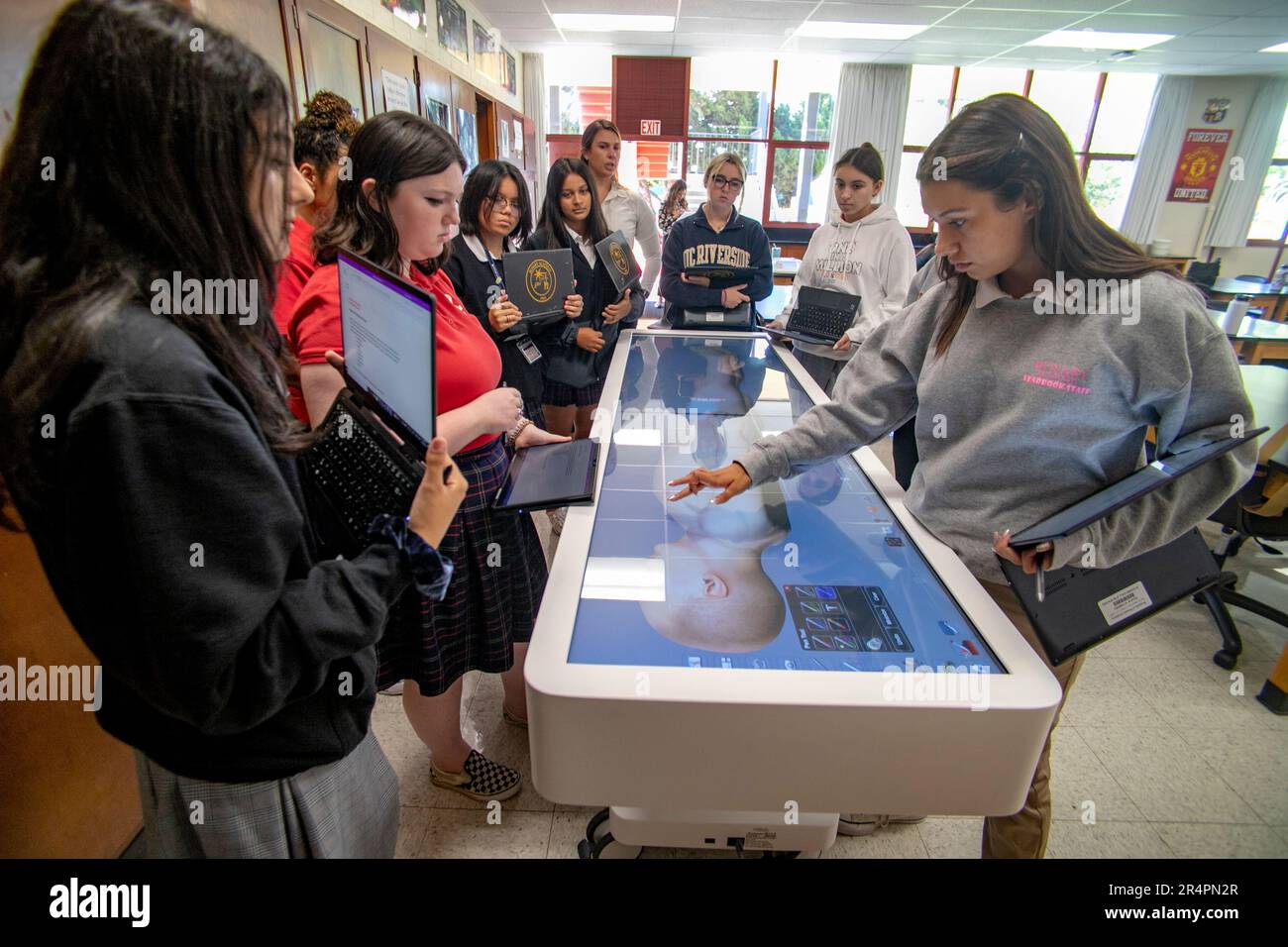 Students at an all girls Southern California Catholic school use an ...