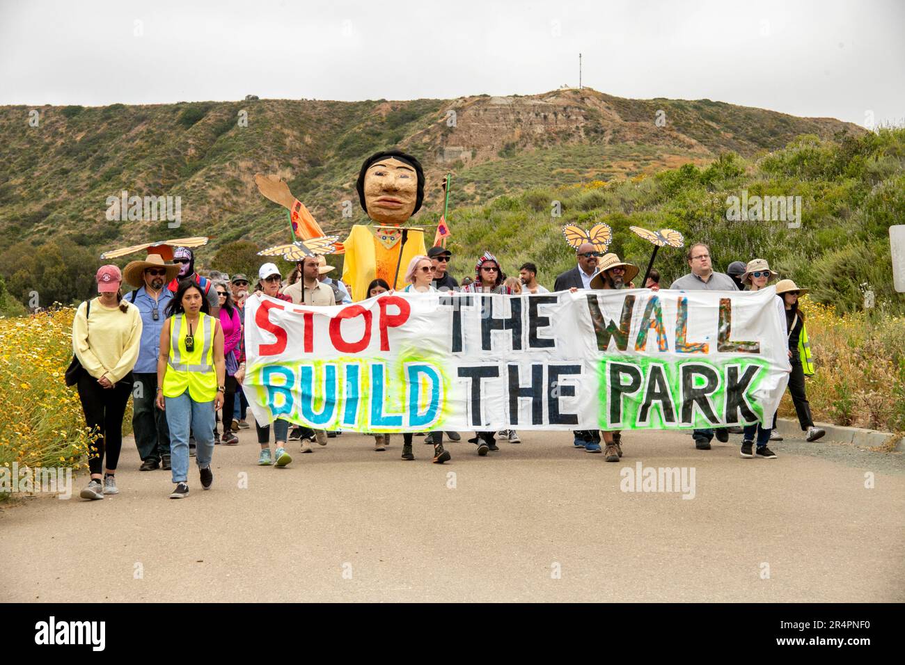 Carrying a figure of a welcoming mother, pro immigration demonstrators ...