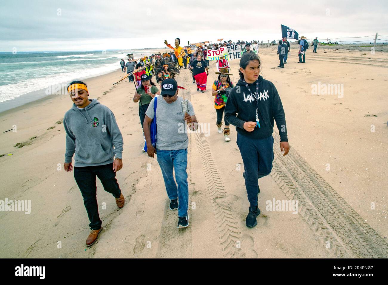 Carrying a figure of a welcoming mother, pro immigration demonstrators ...