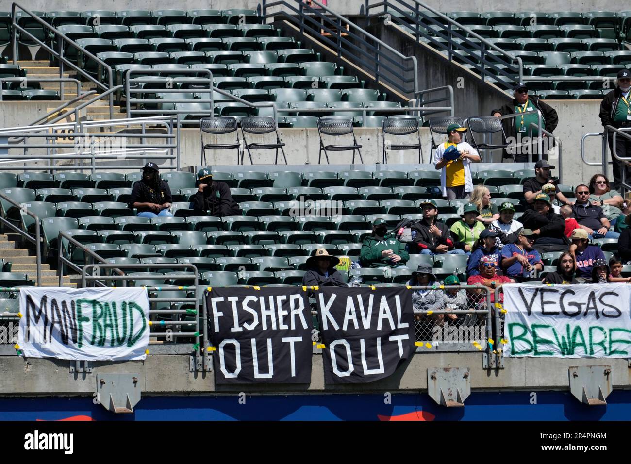 Signs hang in right field at RingCentral Coliseum during a baseball ...
