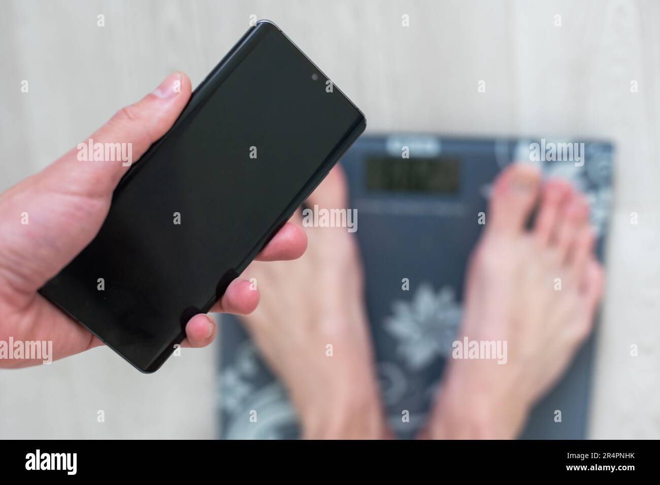 Male on the weight scale for check weight, Diet concept Stock Photo - Alamy