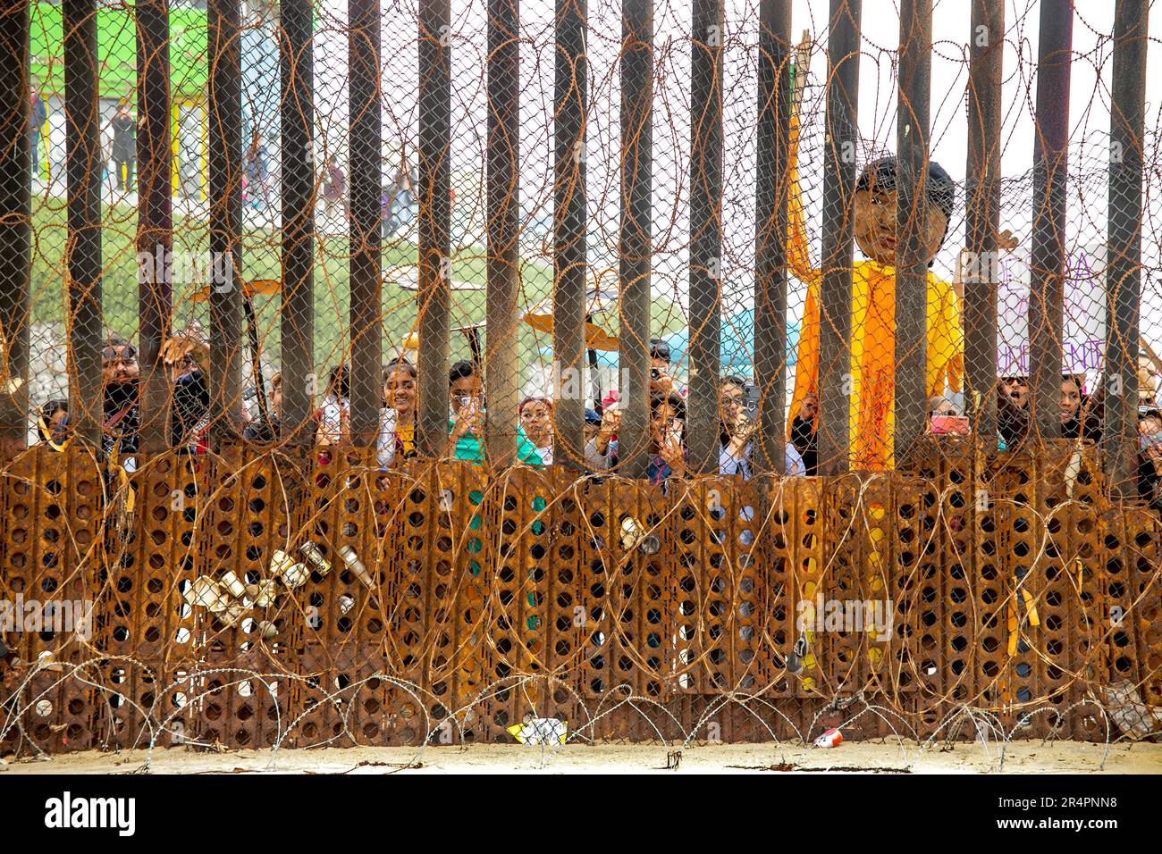 At the US/Mexico border, an iron fence and razor wire separates Tijuana ...
