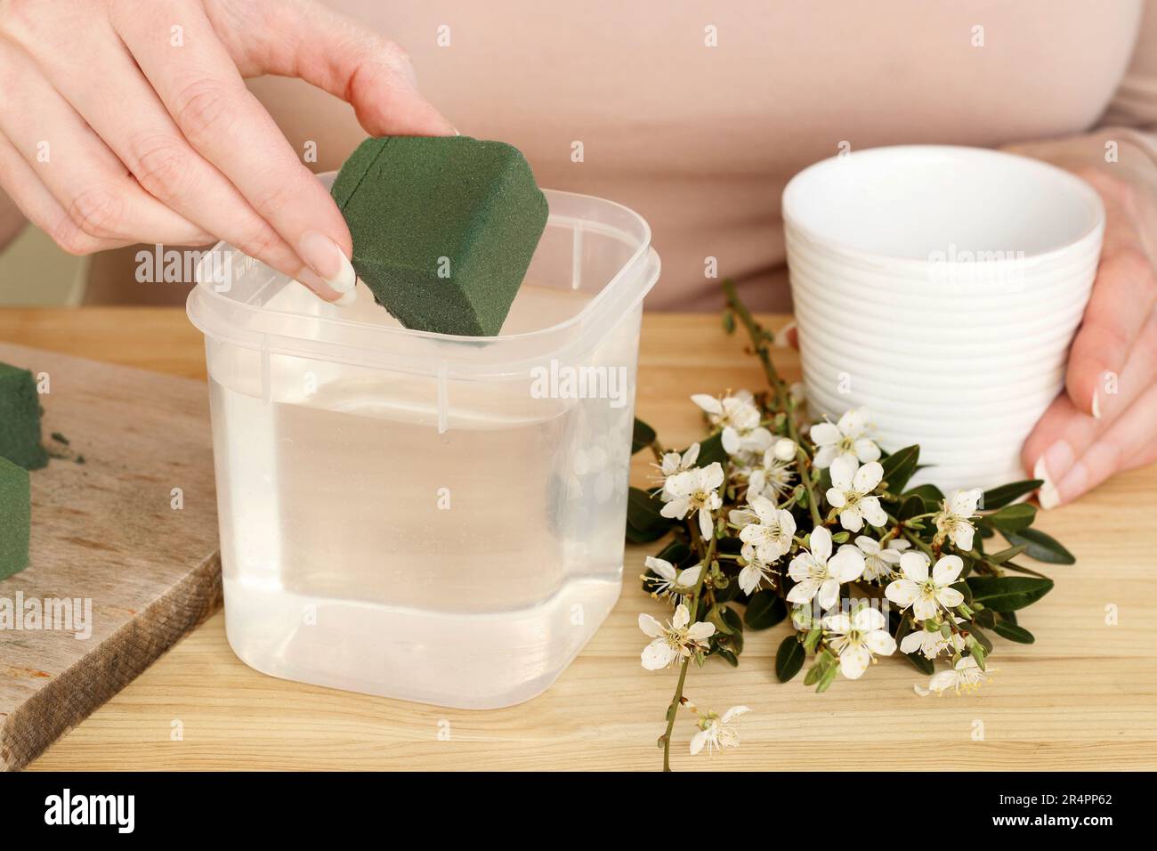 Florist at work: woman shows how to make simple decoration for Easter ...