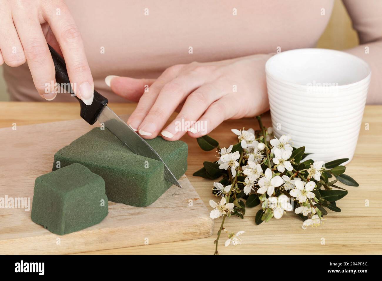 Florist at work: woman shows how to make simple decoration for Easter ...