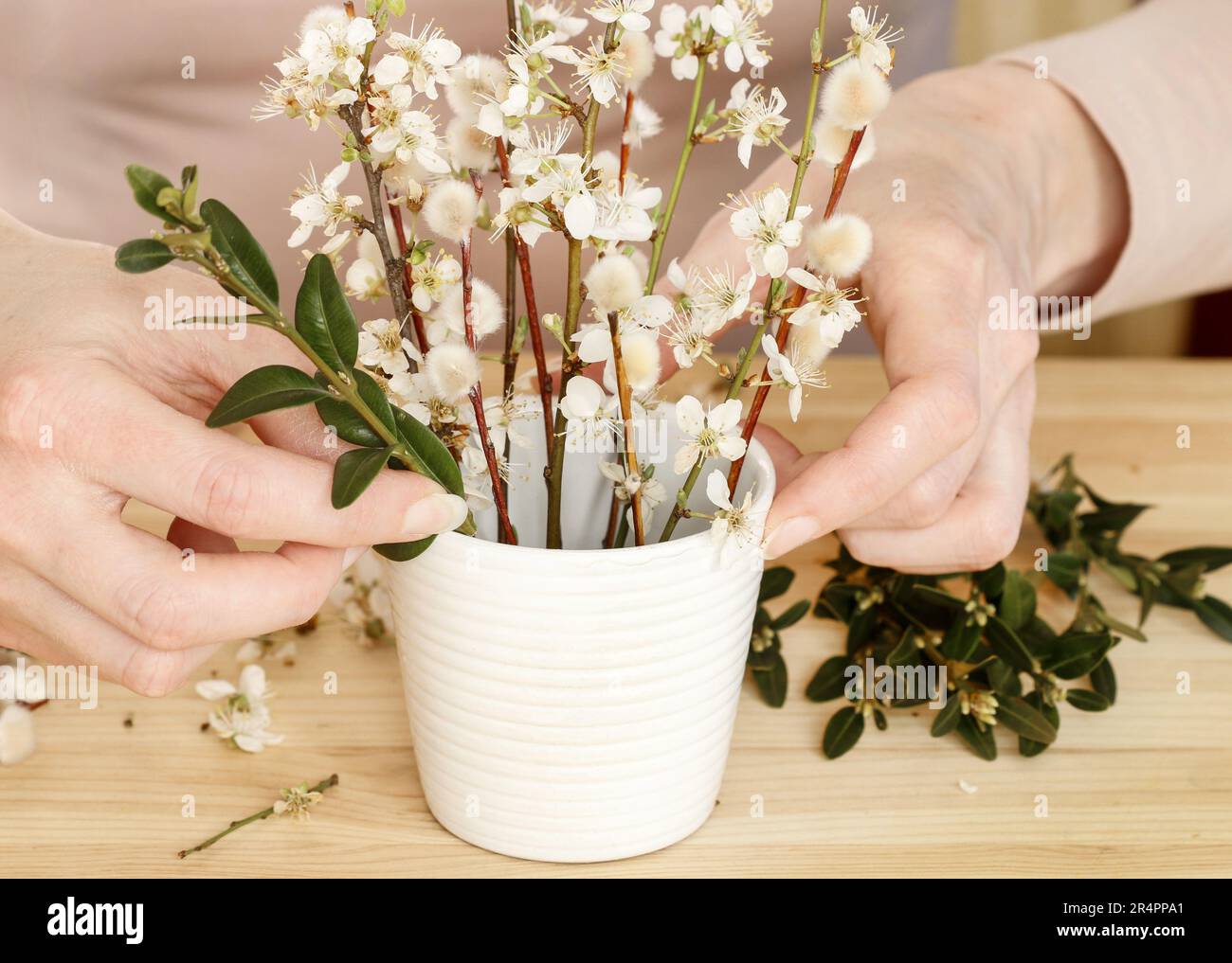 Florist at work: woman shows how to make simple decoration for Easter ...