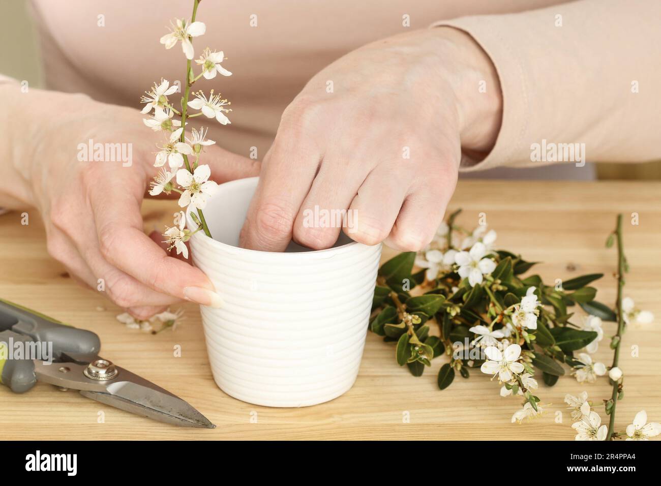 Florist at work: woman shows how to make simple decoration for Easter ...