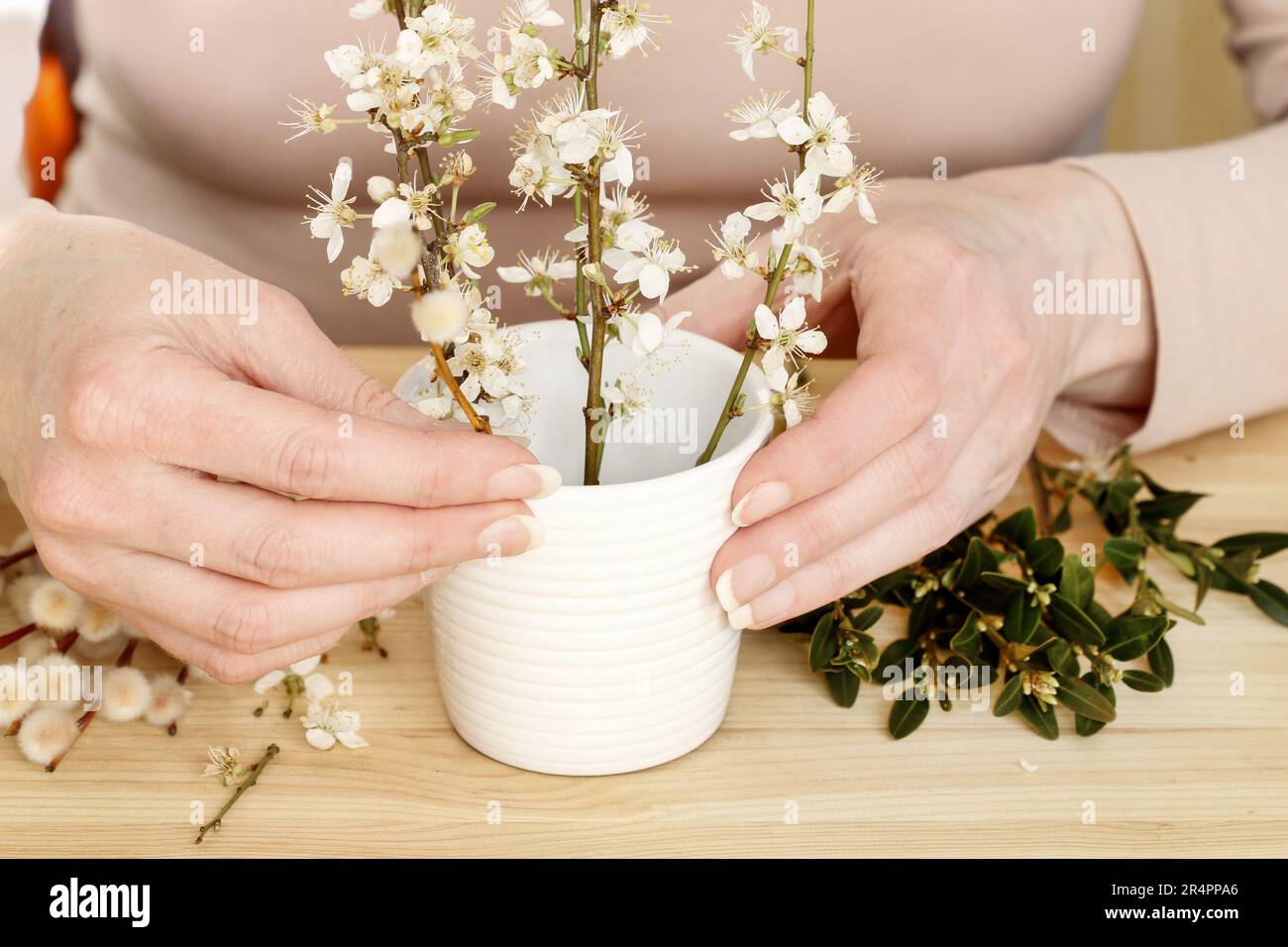 Florist at work: woman shows how to make simple decoration for Easter ...